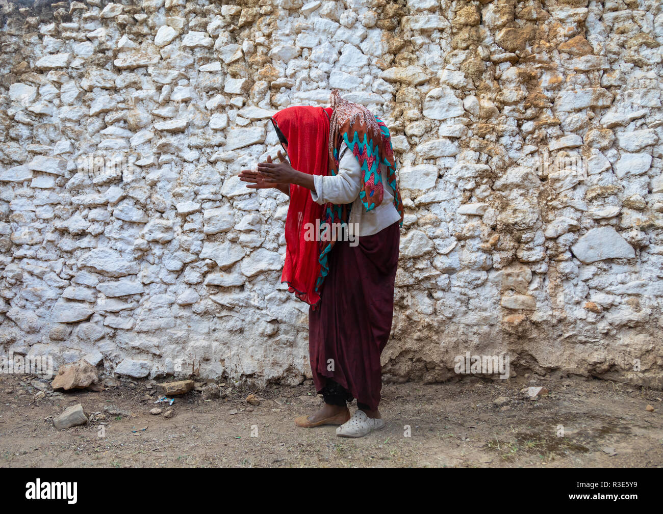 Sufi woman with a red veil into trance during a muslim ceremony, Harari ...