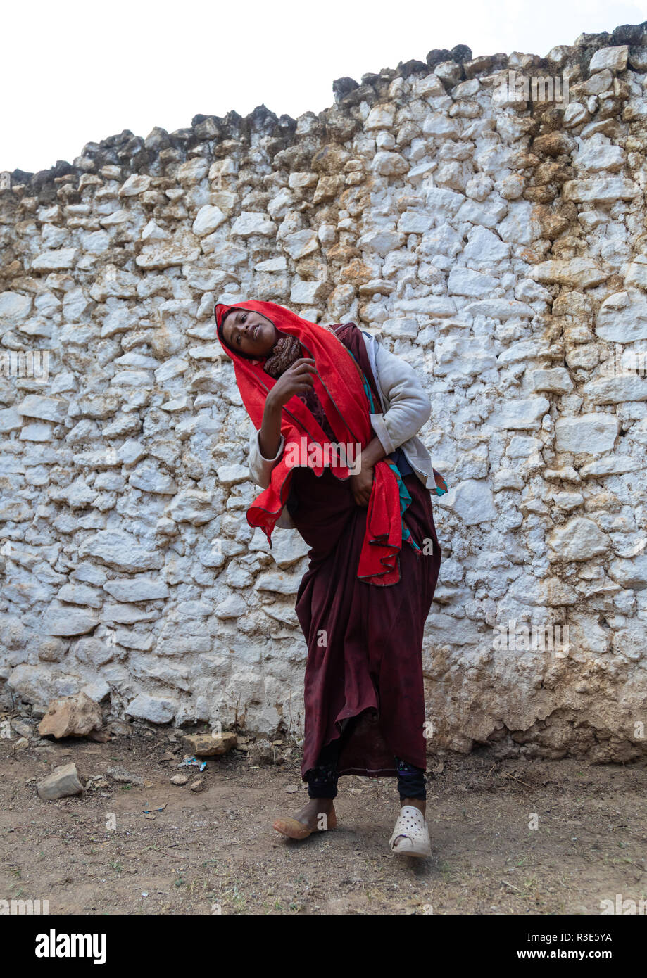 Sufi woman with a red veil into trance during a muslim ceremony, Harari ...