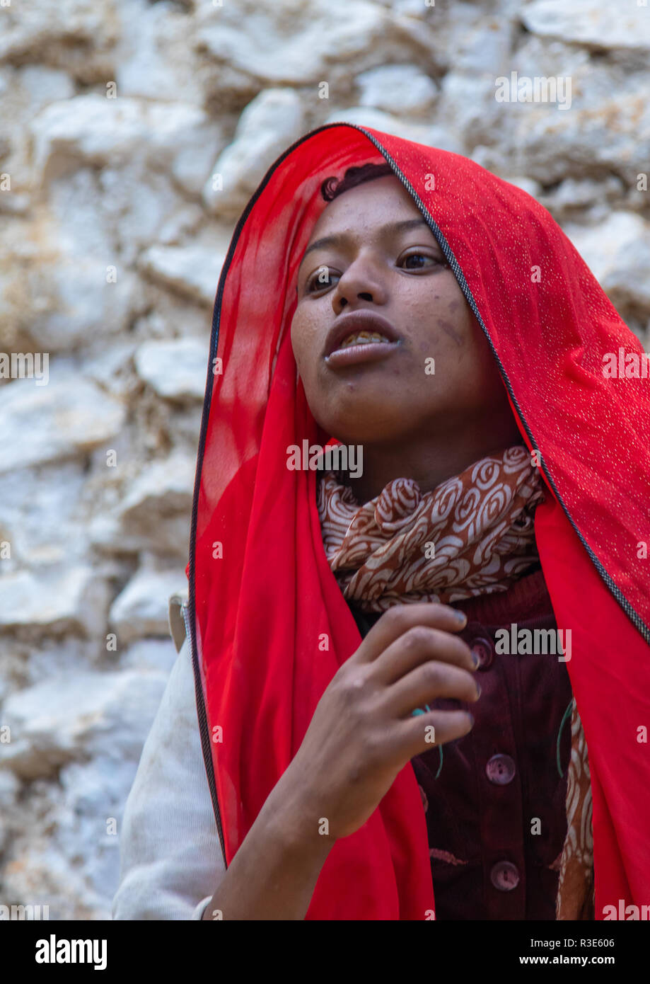 Sufi woman with a red veil into trance during a muslim ceremony, Harari ...