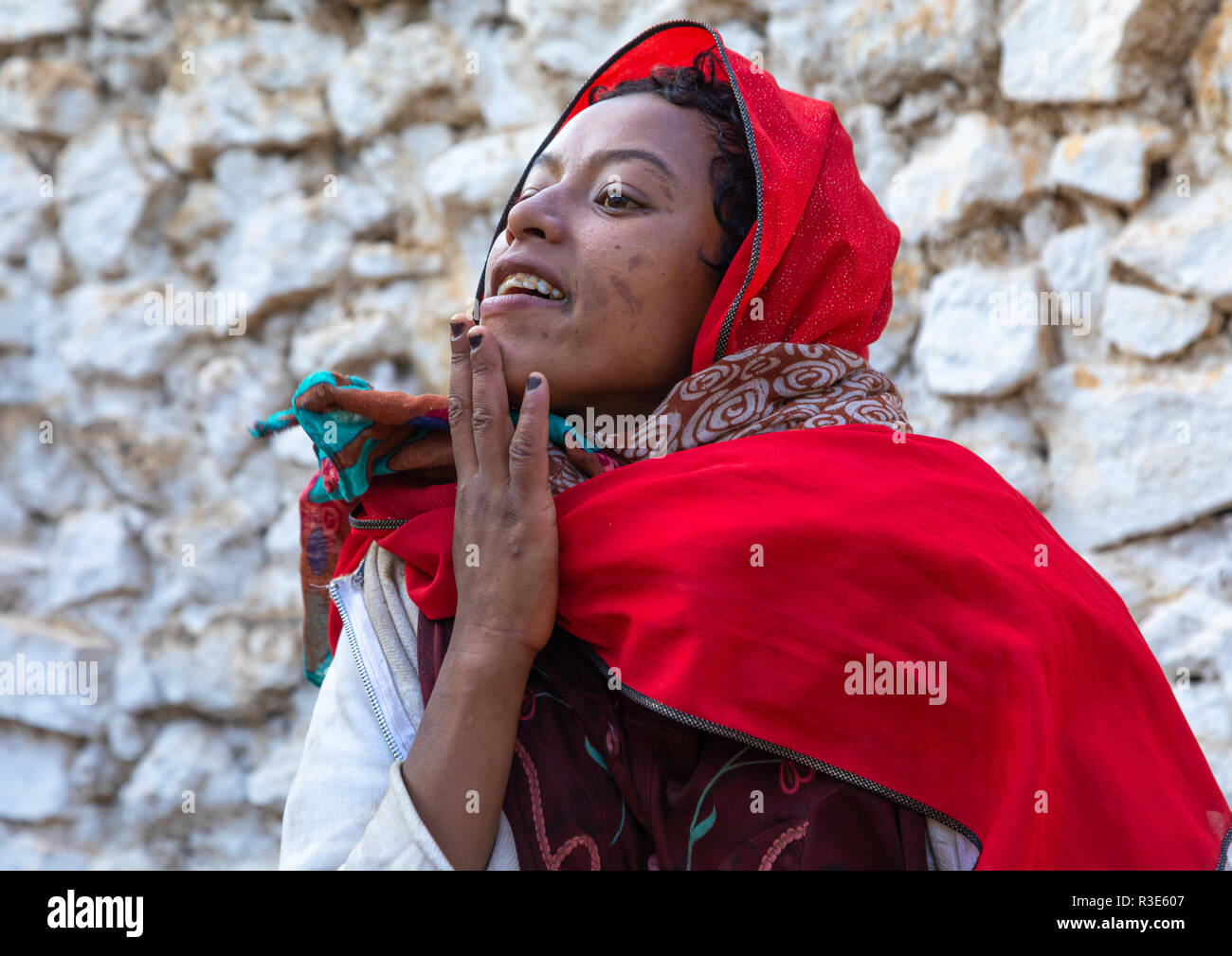Sufi woman with a red veil into trance during a muslim ceremony, Harari ...