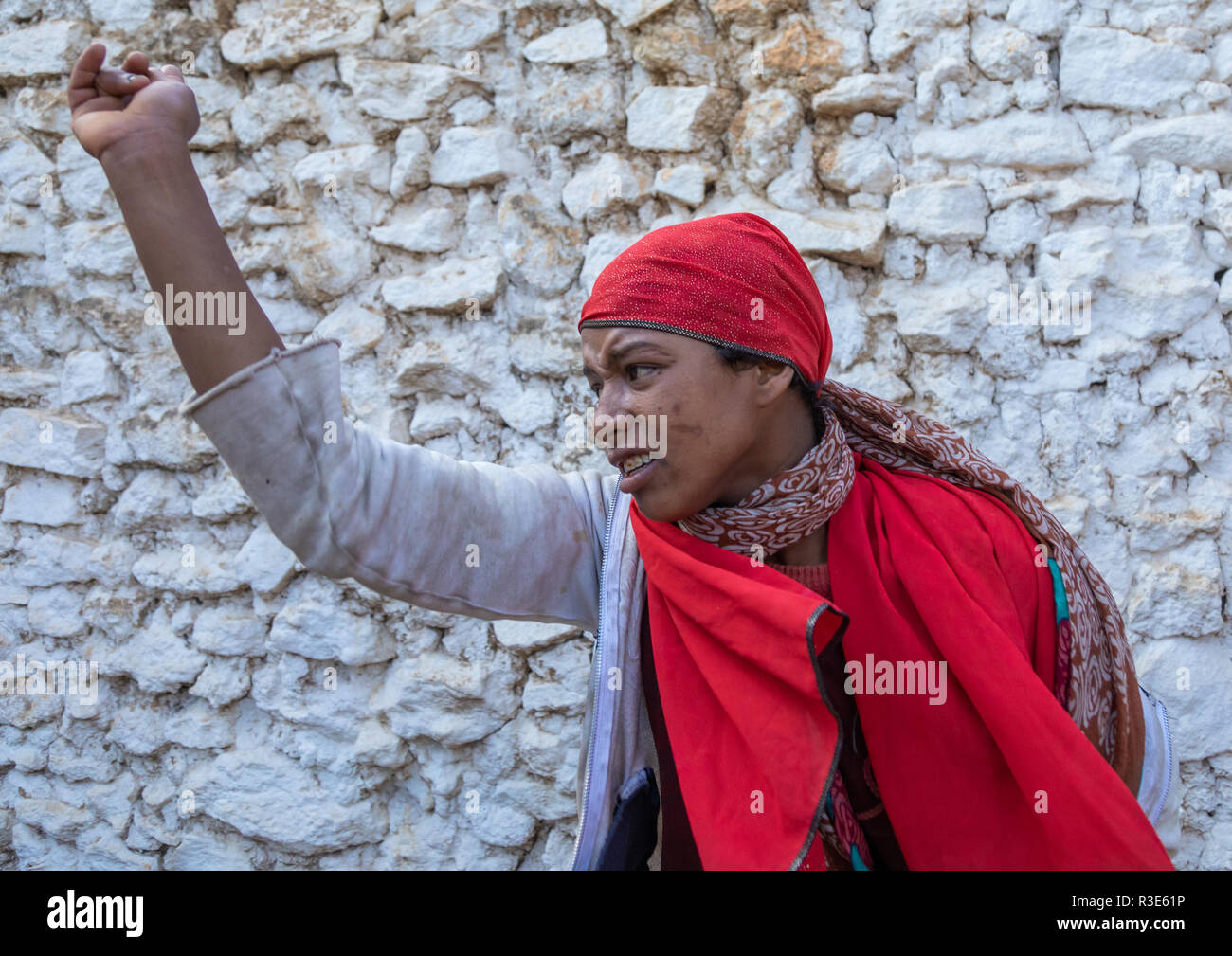 Sufi woman with a red veil into trance during a muslim ceremony, Harari ...