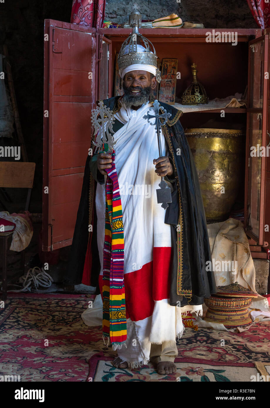 Ethiopian orthodox priest in nakuto lab rock church holding a cross ...