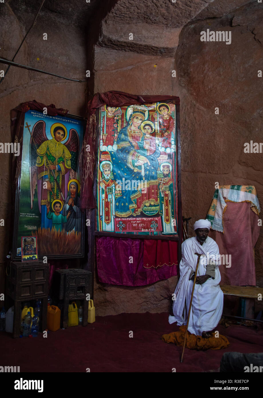 Orthodox priest inside bete gabriel rafael twin church, Amhara Region ...