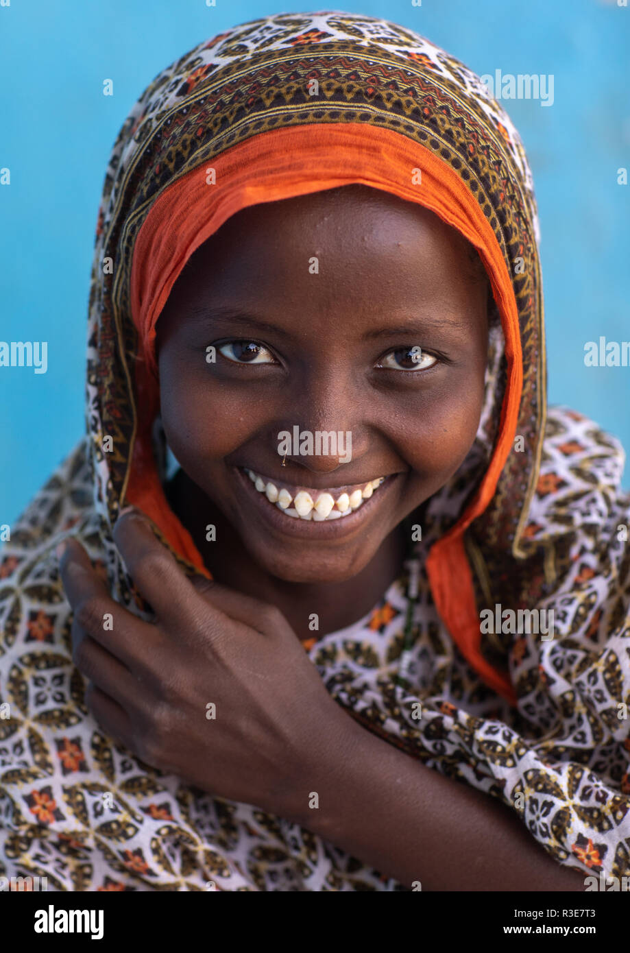Portrait Of A Veiled Smiling Afar Tribe Girl With Sharpened Teeth Afar