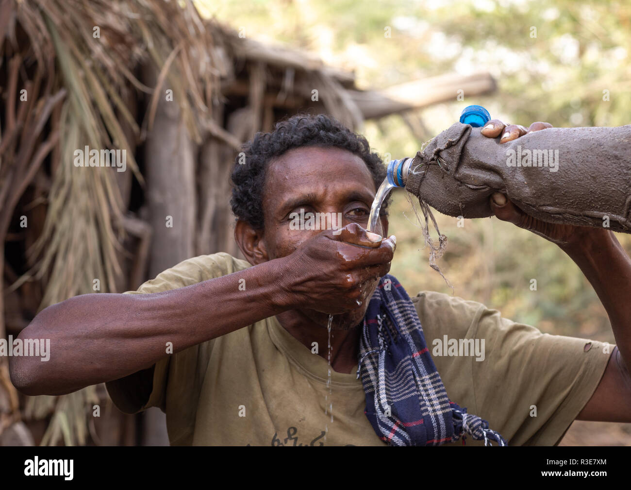 Afar tribe man drinking water, Afar Region, Afambo, Ethiopia Stock ...