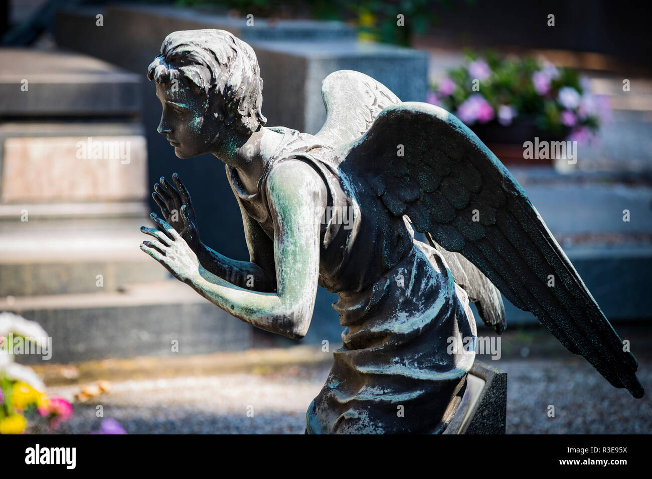 MILAN, ITALY - JUNE 6, 2018 : Statues of mourning at the graves of the ...