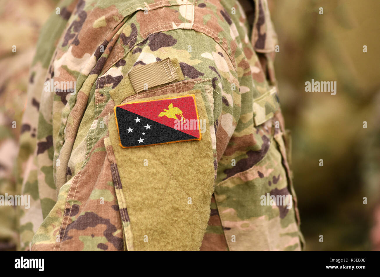 Papua New Guinea flag on soldiers arm. Papua New Guinea troops (collage ...