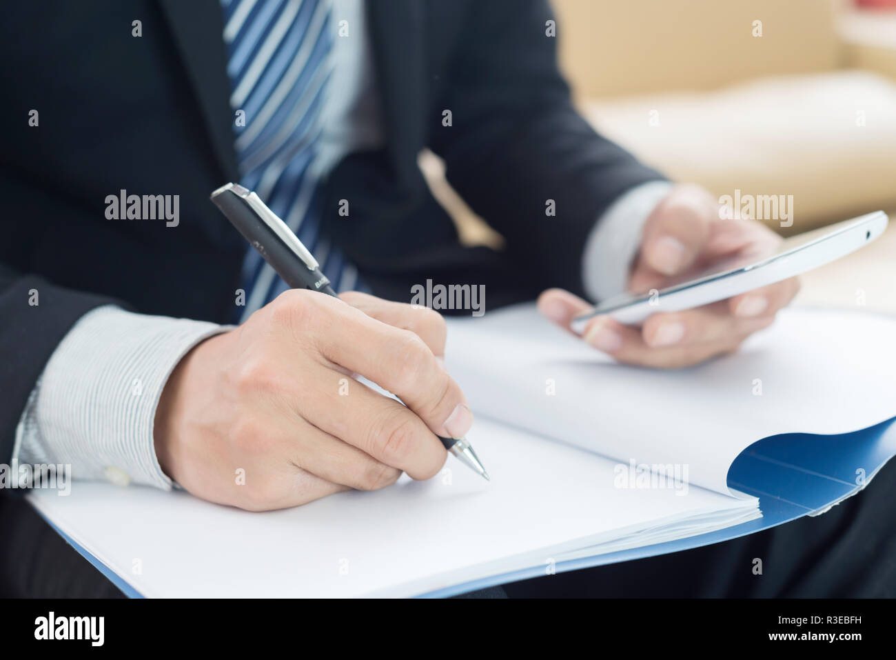 Image of businessman's hands laying on table with pen Stock Photo - Alamy