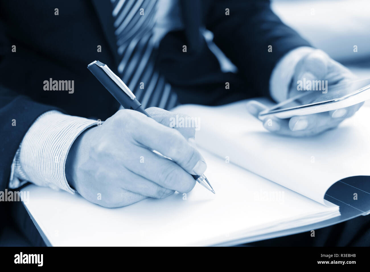 Image of businessman's hands laying on table with pen Stock Photo - Alamy