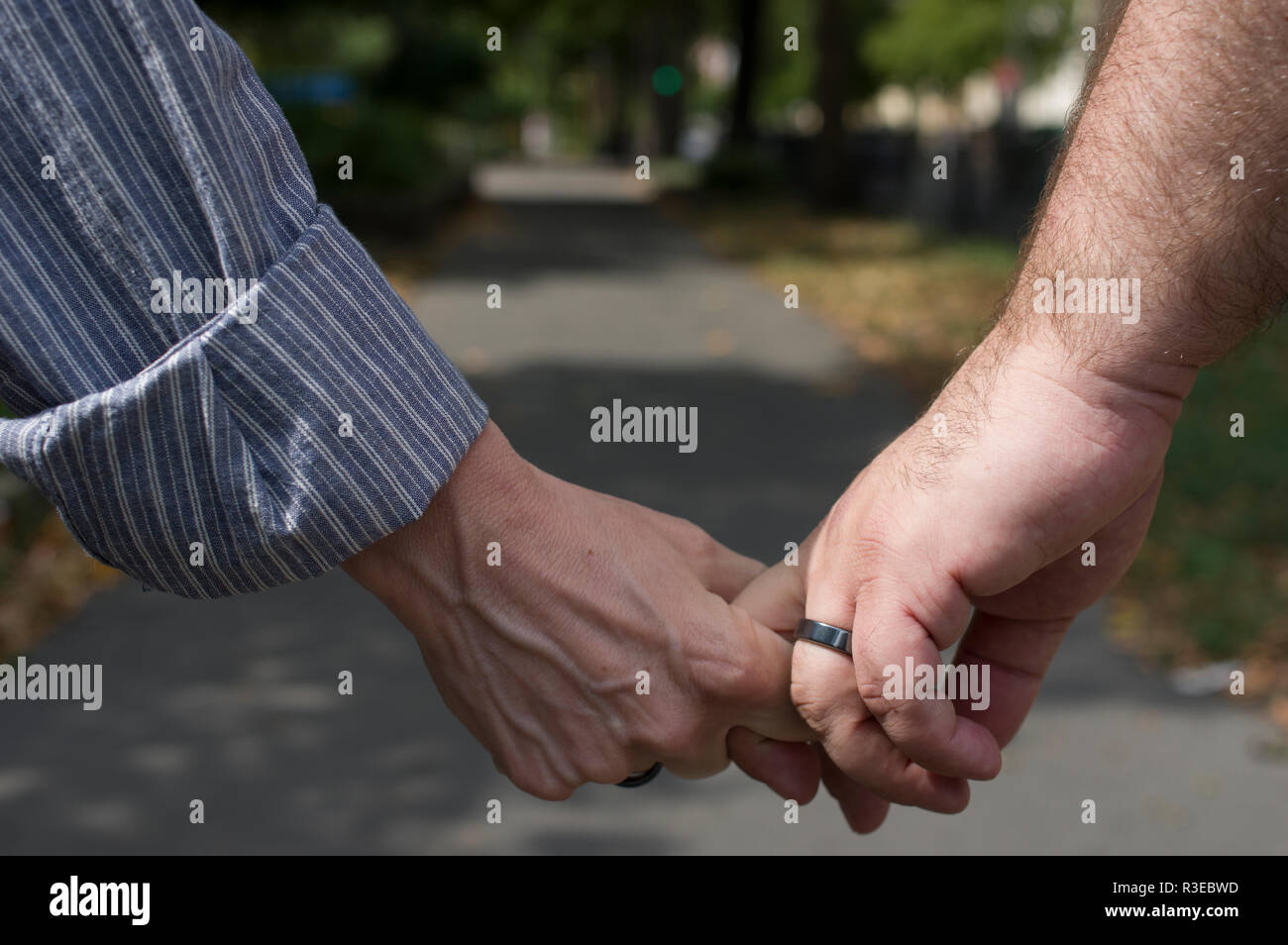 Couple holding hands outside in Berlin, Germany Stock Photo - Alamy