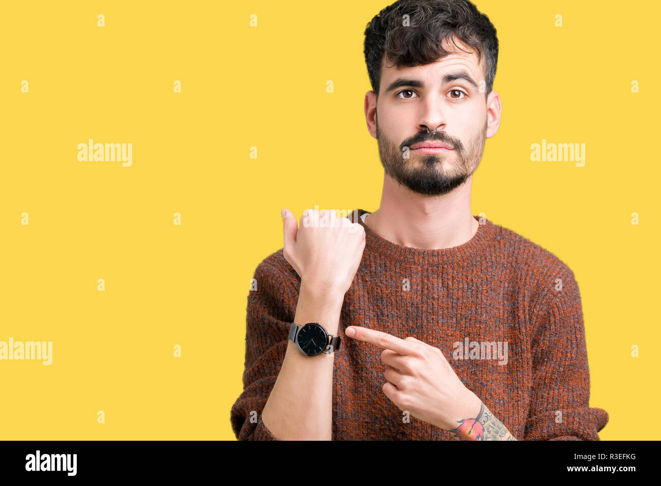 Young handsome man wearing winter sweater over isolated background In ...