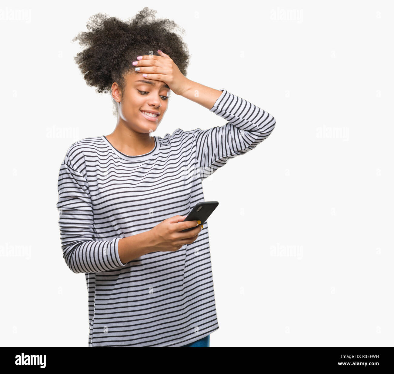 Young afro american woman texting using smartphone over isolated ...
