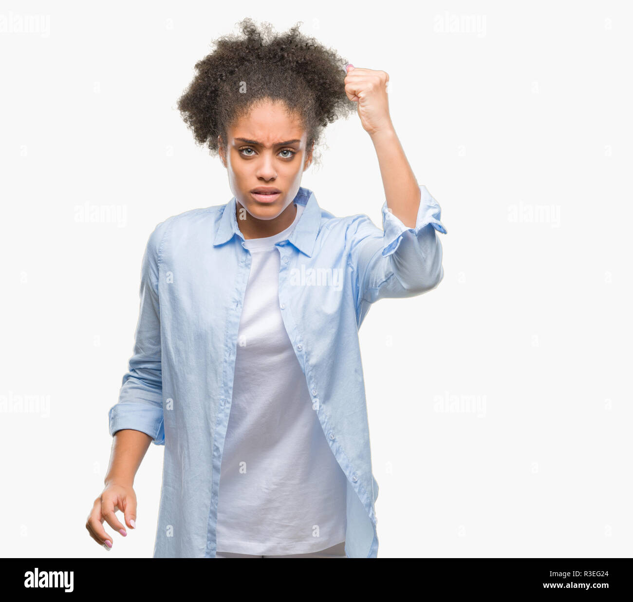 Young afro american woman over isolated background angry and mad ...