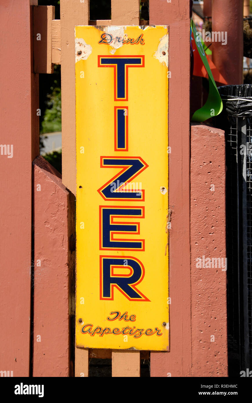Old metal advertisement for Tizer Stock Photo - Alamy