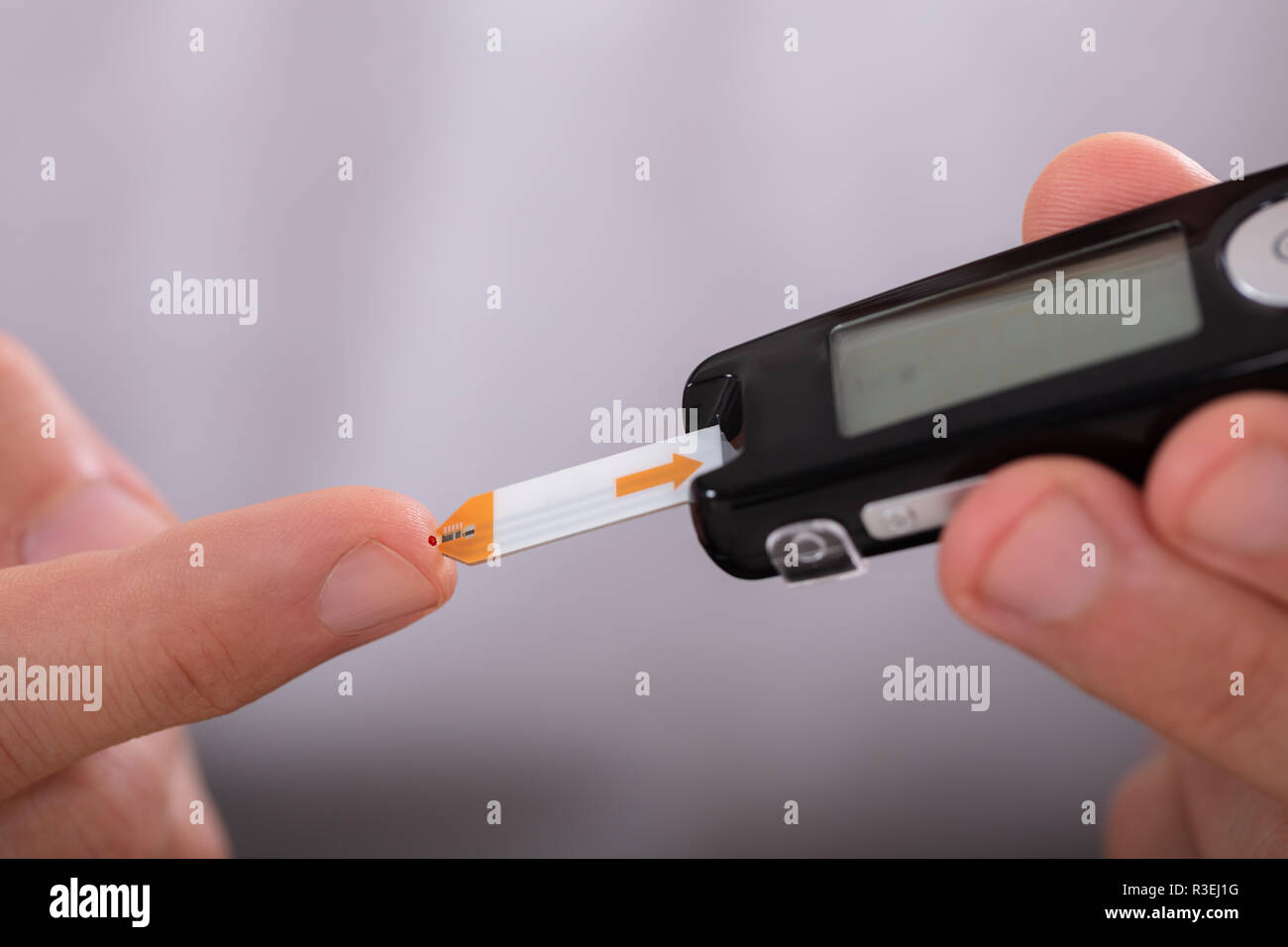 Doctor hand hold glucose meter hi-res stock photography and images - Alamy