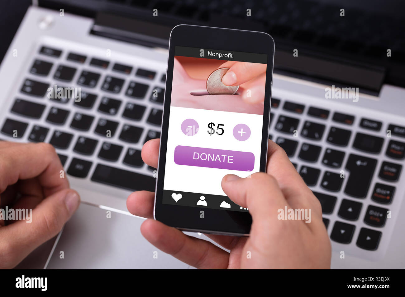 Man hand donating money hi-res stock photography and images - Alamy