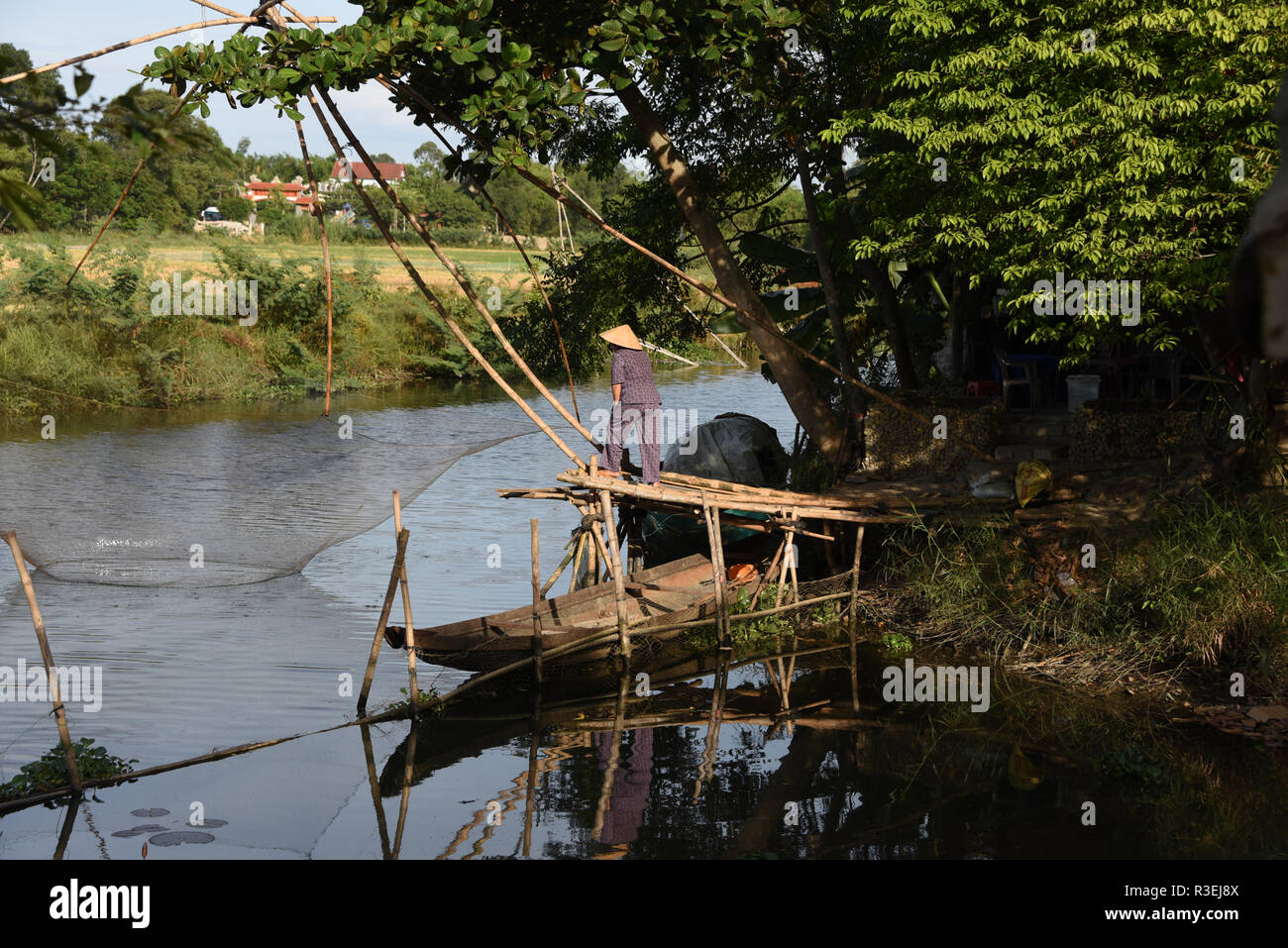 Asian woman fishing hi-res stock photography and images - Alamy