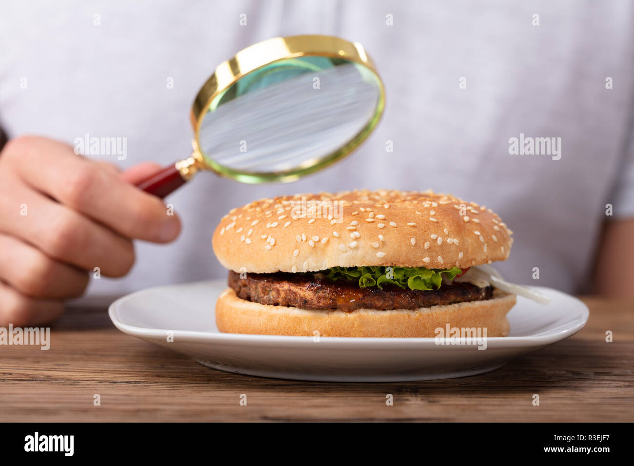 Magnifying glass examining burger hi-res stock photography and images ...