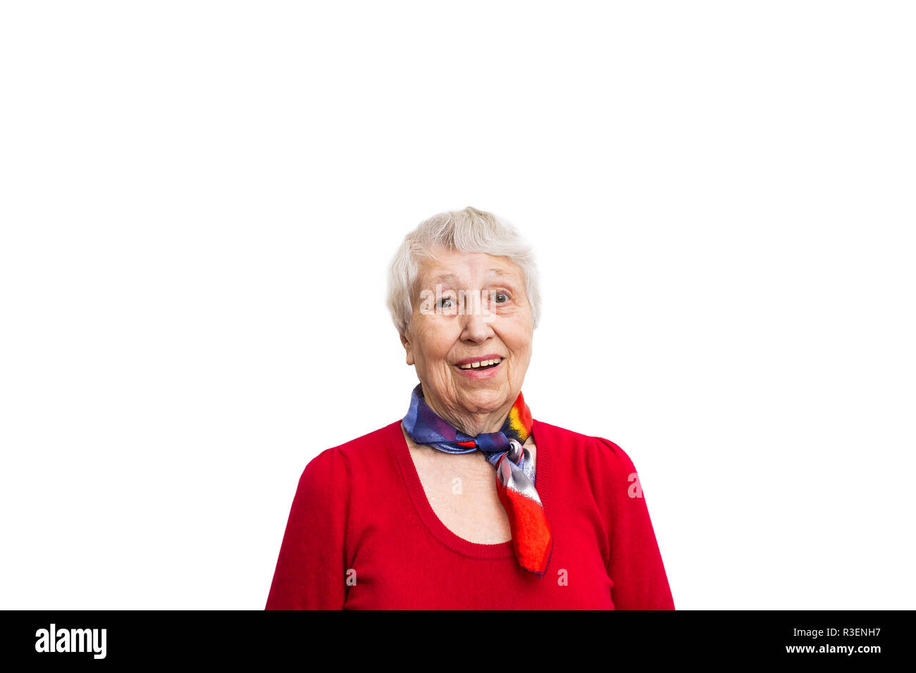 Old smiling woman with surprised expression on her face on studio ...