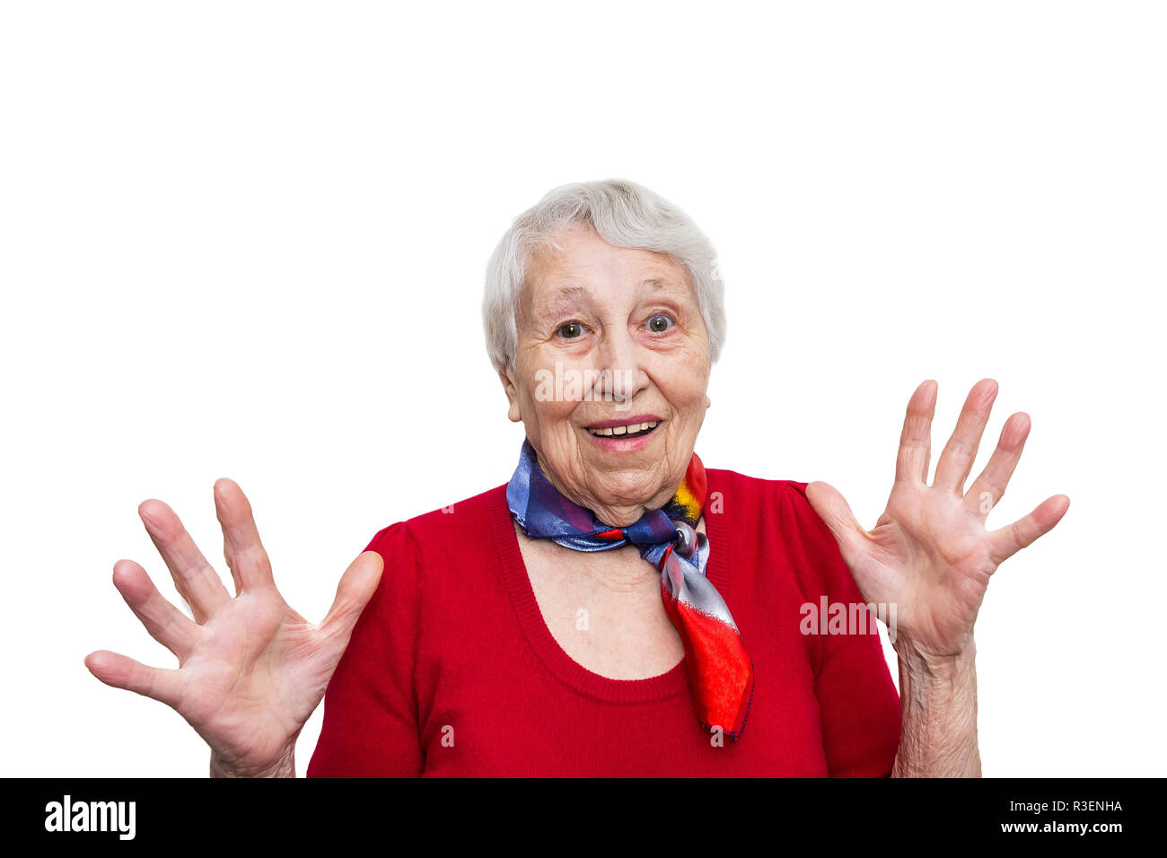Old smiling woman with surprised expression on her face on studio ...