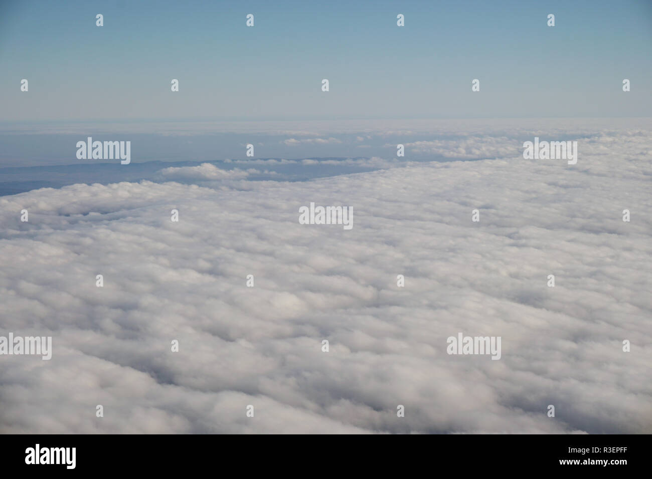 blue sky above white clouds from inside plane Stock Photo - Alamy