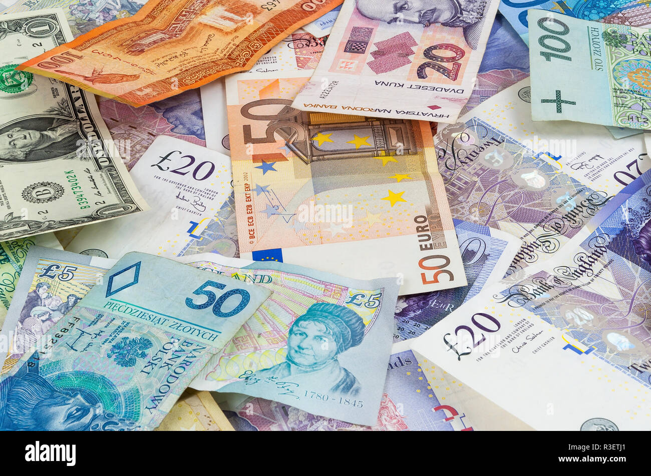 different currencies banknotes background Stock Photo - Alamy