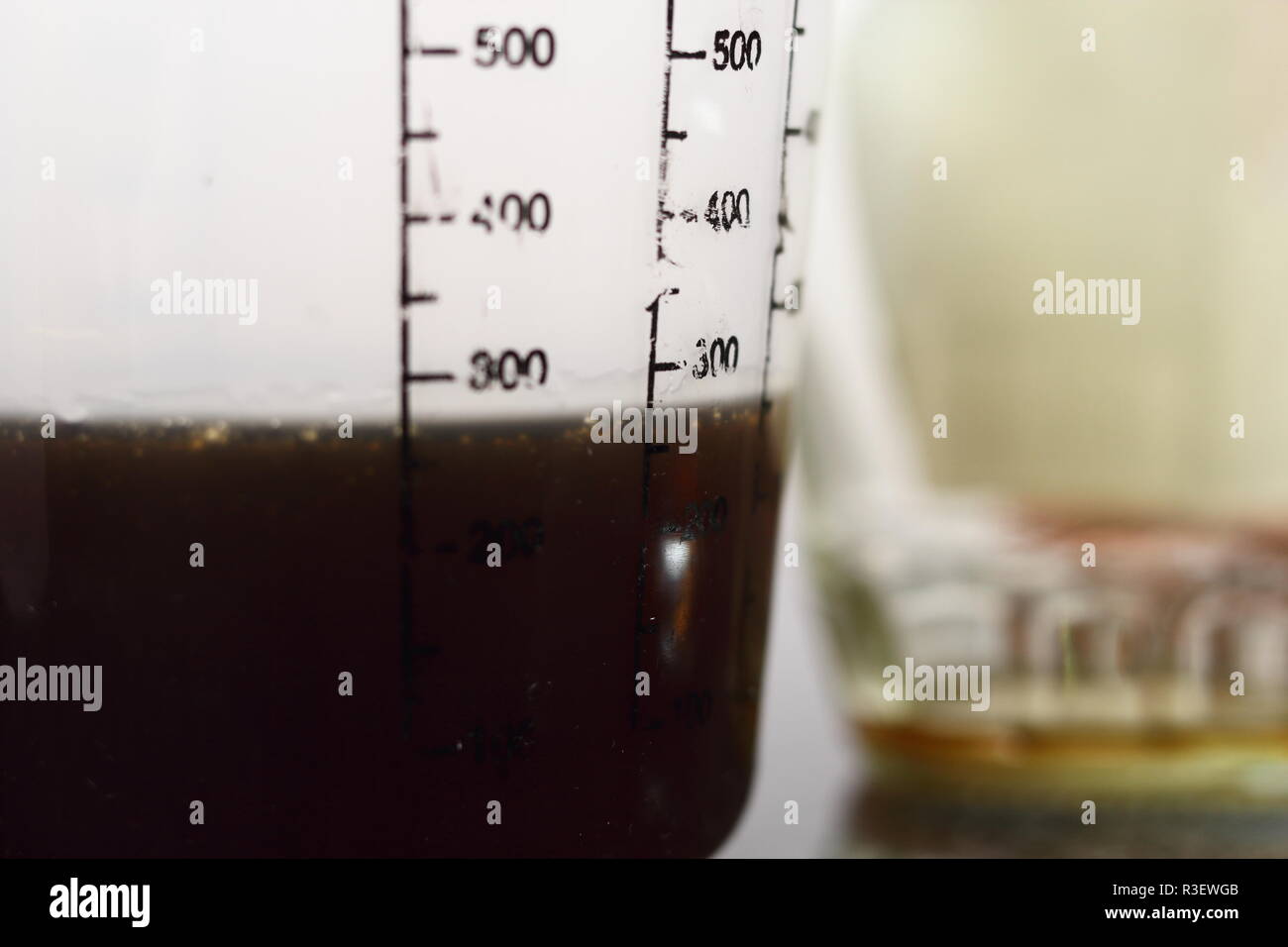 Maple syrup in measuring cup Stock Photo - Alamy
