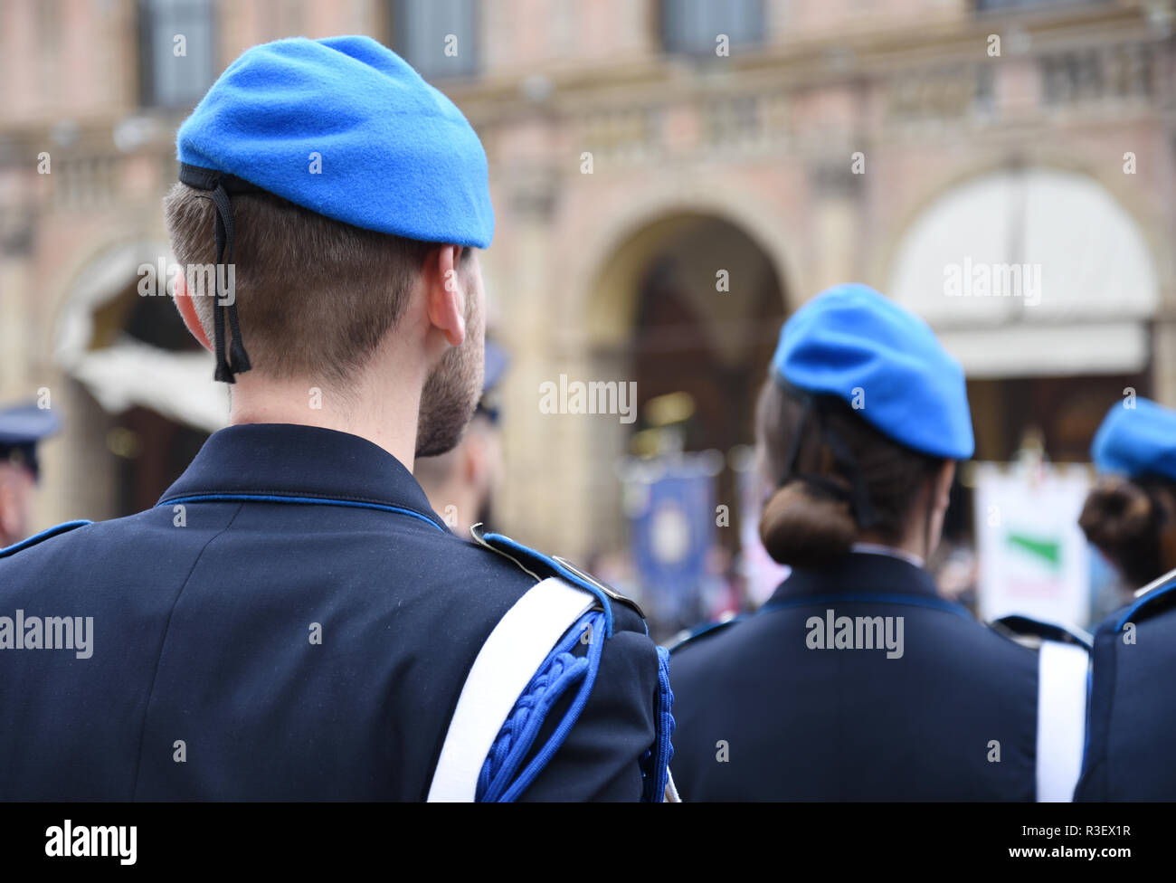 Some soldiers in blue uniform of the Italian army including women in ...