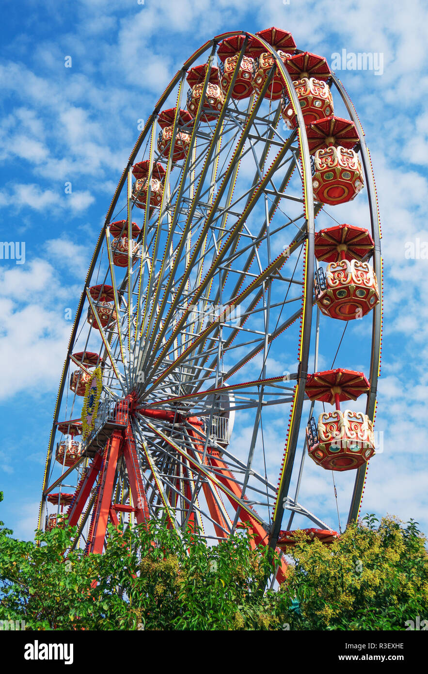 Red ferris wheel in the city park Stock Photo - Alamy