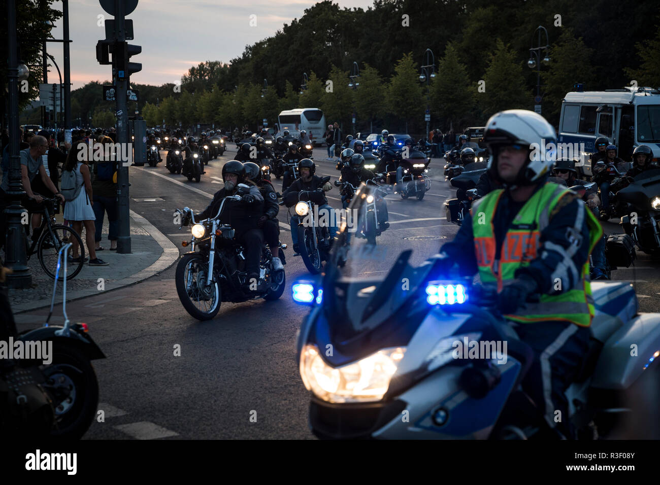 Bikers turning onto Ebertstrasse near the Brandenburg Gate and the ...