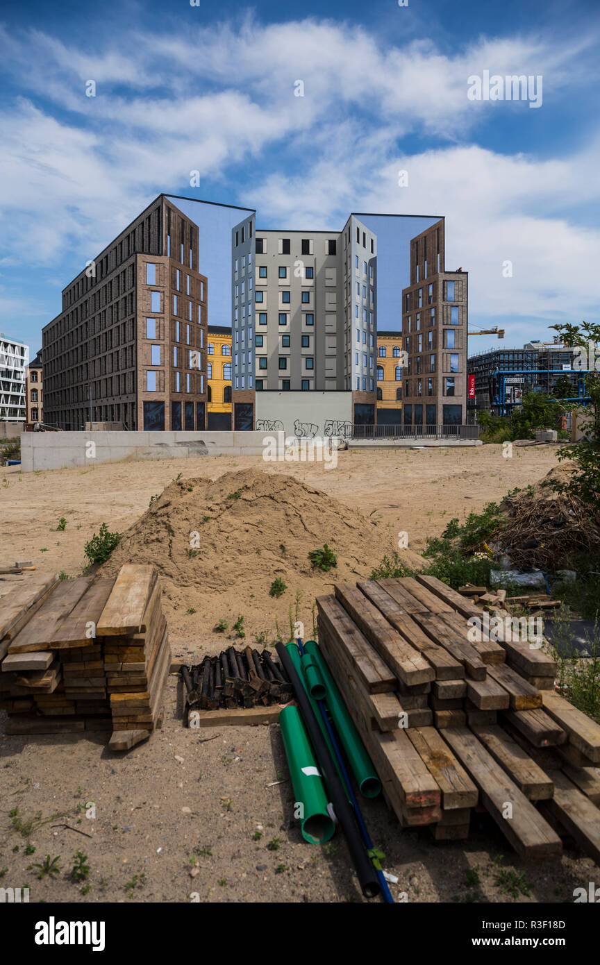 Construction materials at a building site in front of a fake building ...