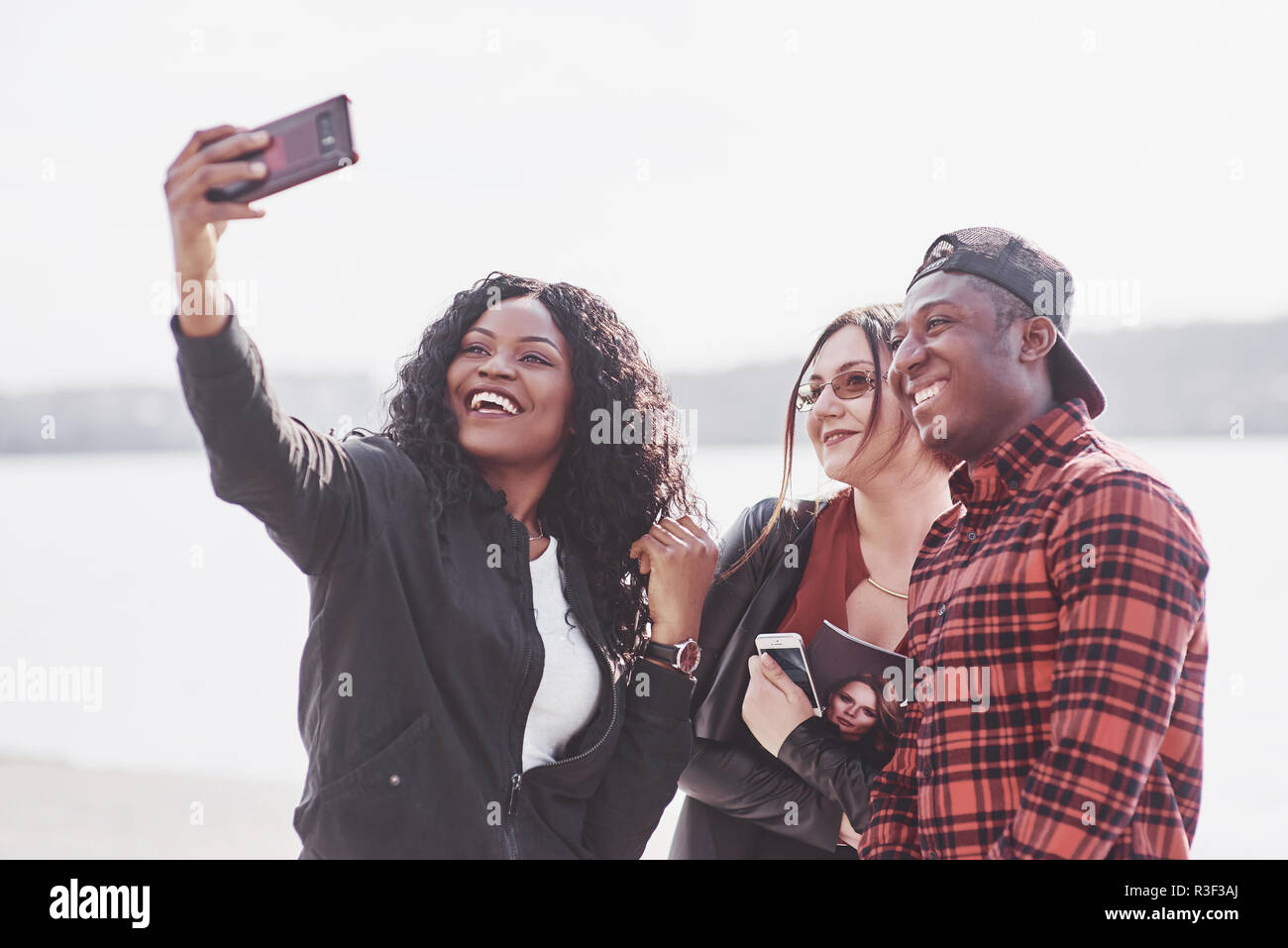 Laughing white girl black boy hi-res stock photography and images - Alamy