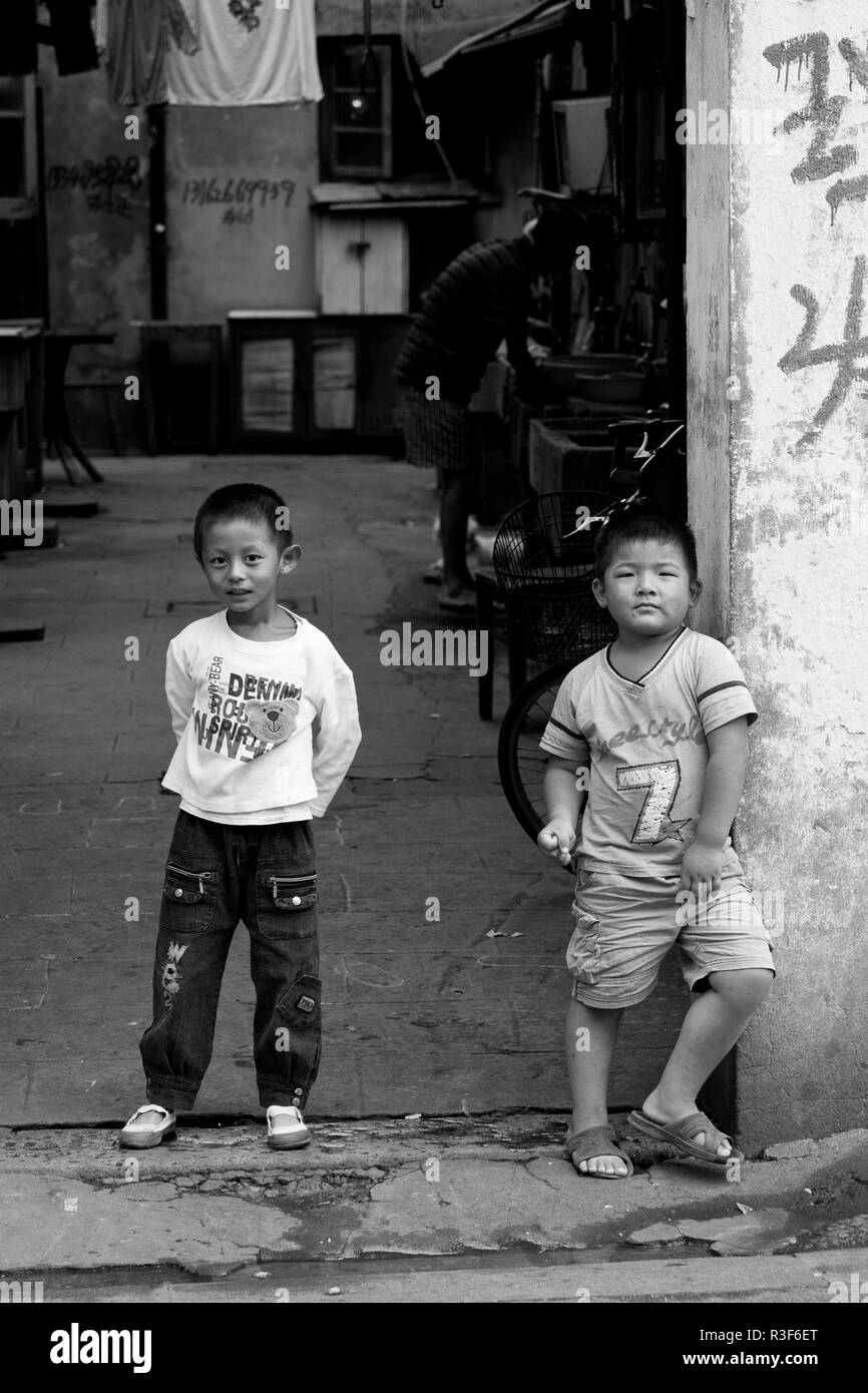 Two curious boys in ''their'' street in Shanghai, China Stock Photo - Alamy