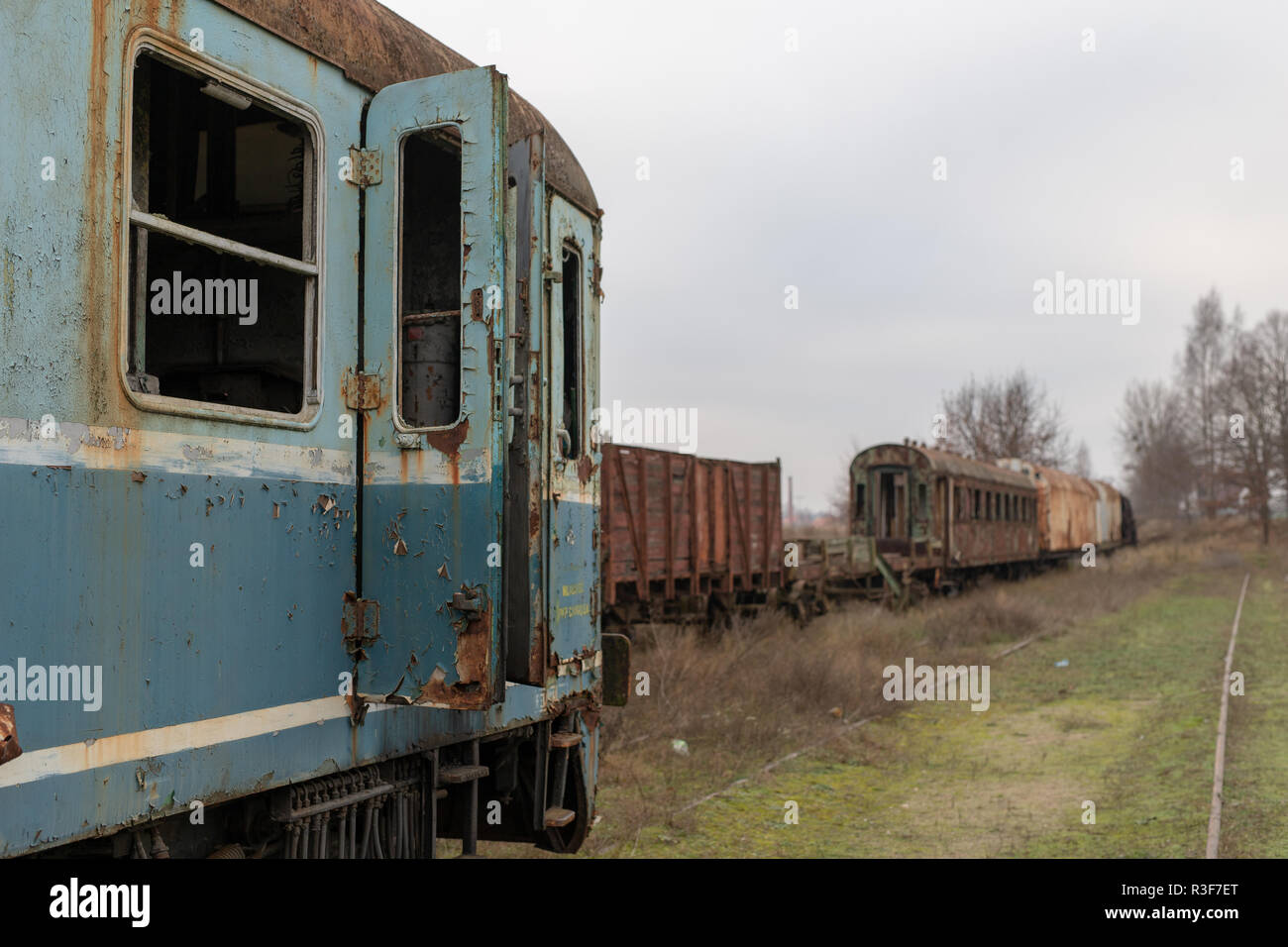 Old destroyed railway wagons. Forgotten railway station in central ...