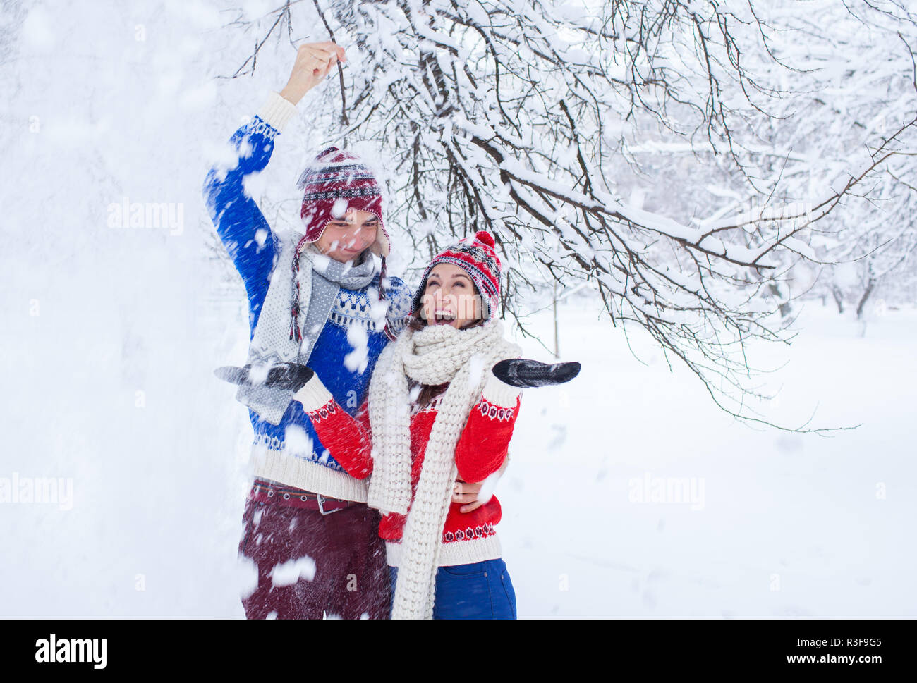 Woman shake snow tree hi-res stock photography and images - Alamy