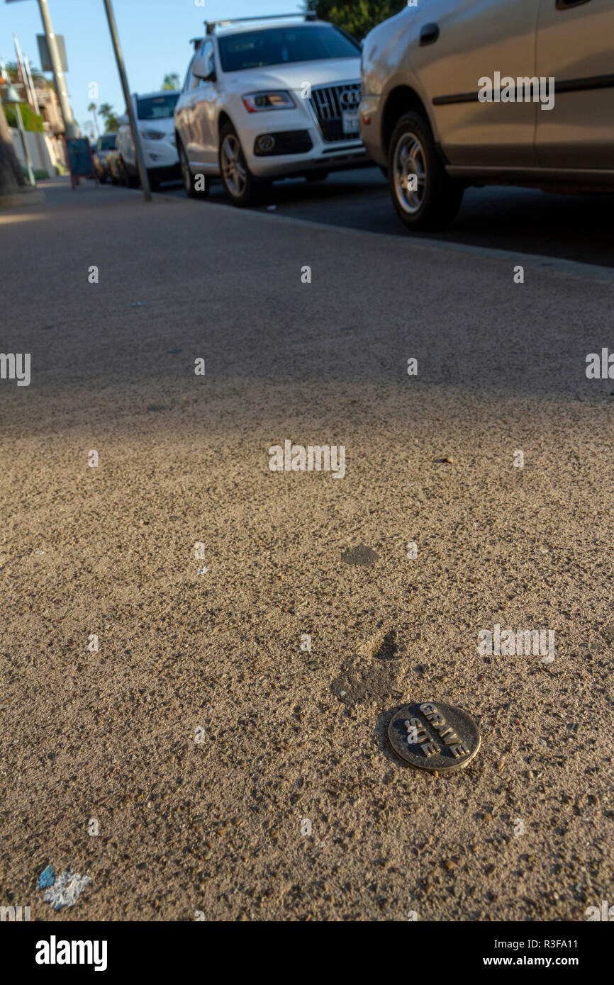 Grave site marker on the sidewalk outside the Cemetery of El Campo ...