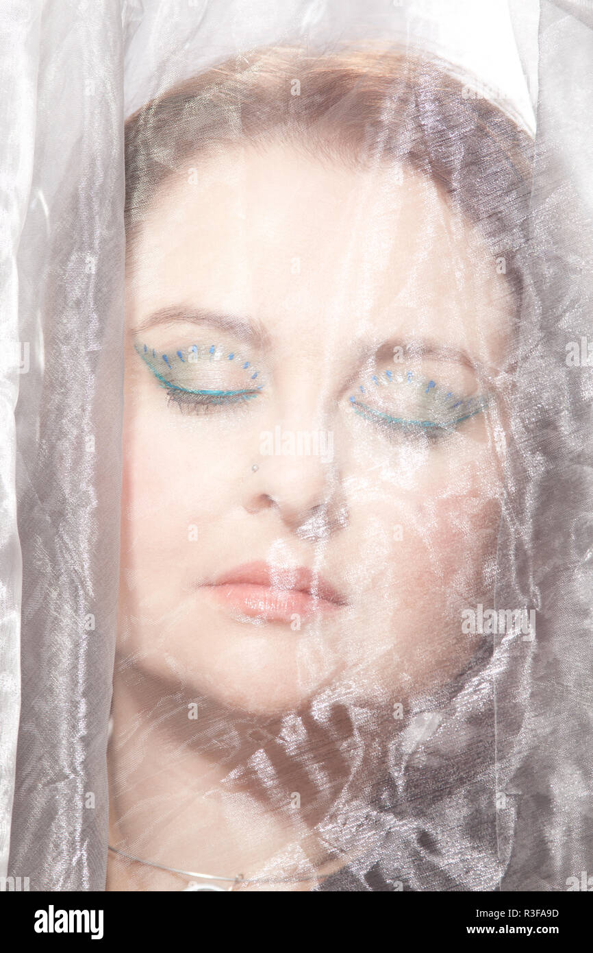 glamorous face painted behind a veil Stock Photo - Alamy