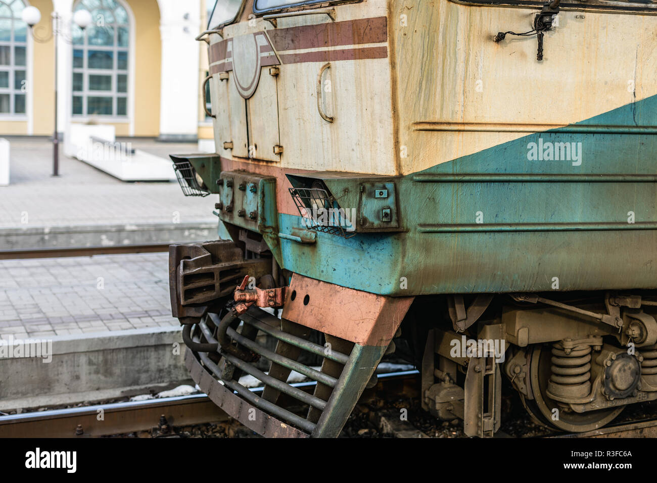 close-up Old rusty diesel train locomotive at railway station. Outdated ...