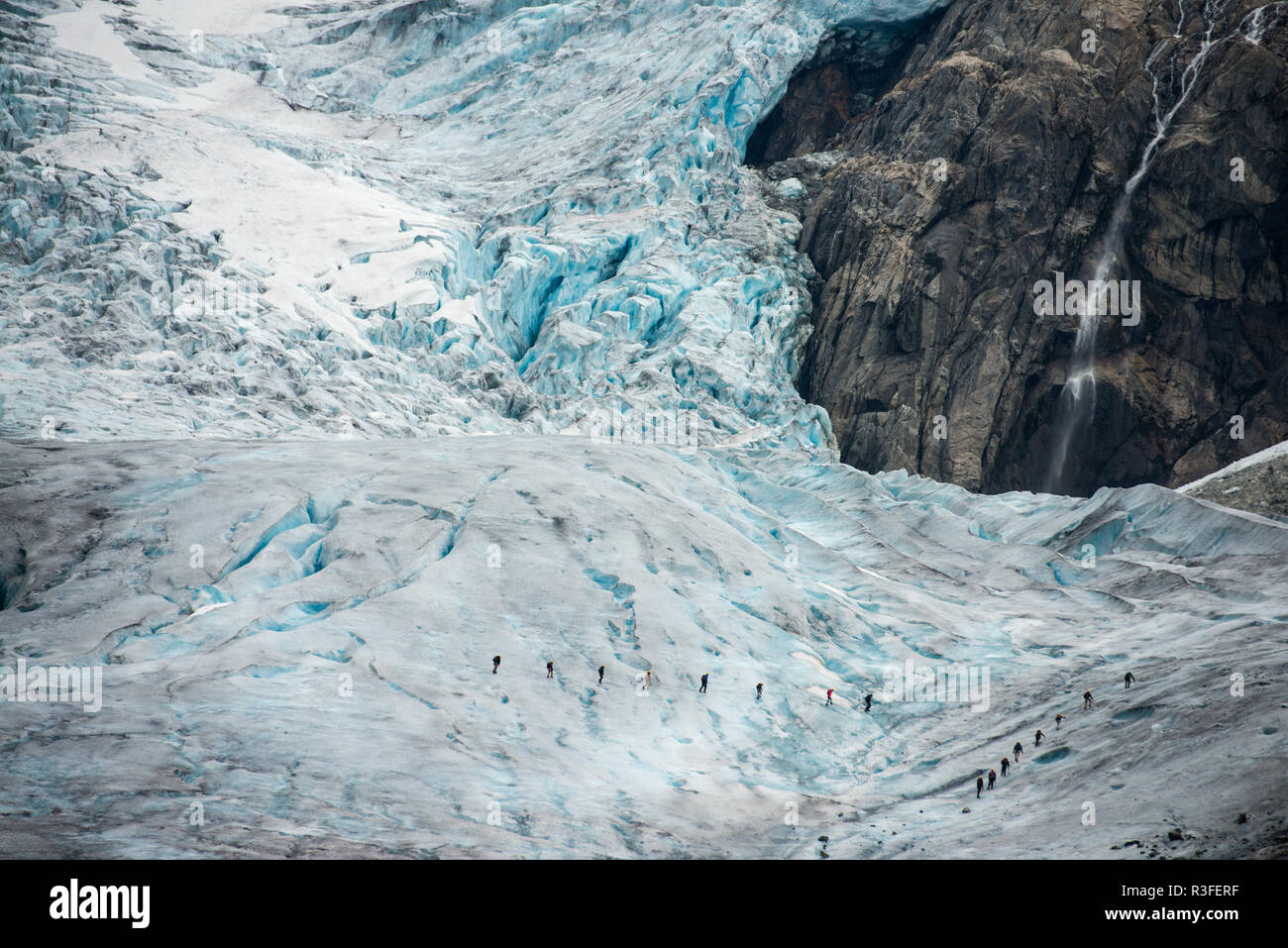 Tourist crossing the Buarbreen glacier. Buerbreen is a glacier in the ...