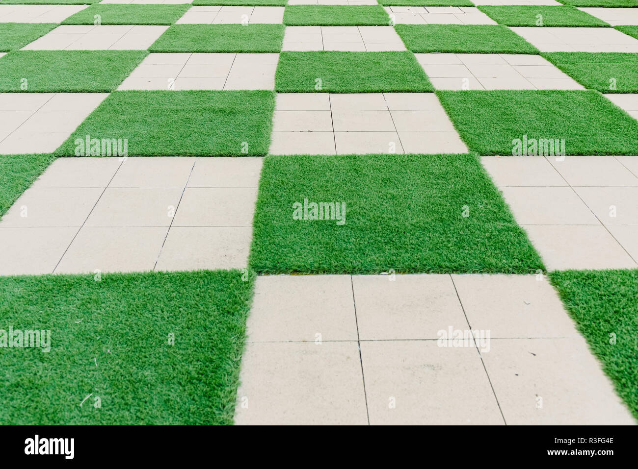 Square pattern of cement and grass Stock Photo - Alamy