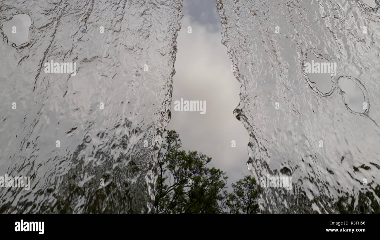 Wide stream of water falling in a semi-translucent park Stock Photo - Alamy