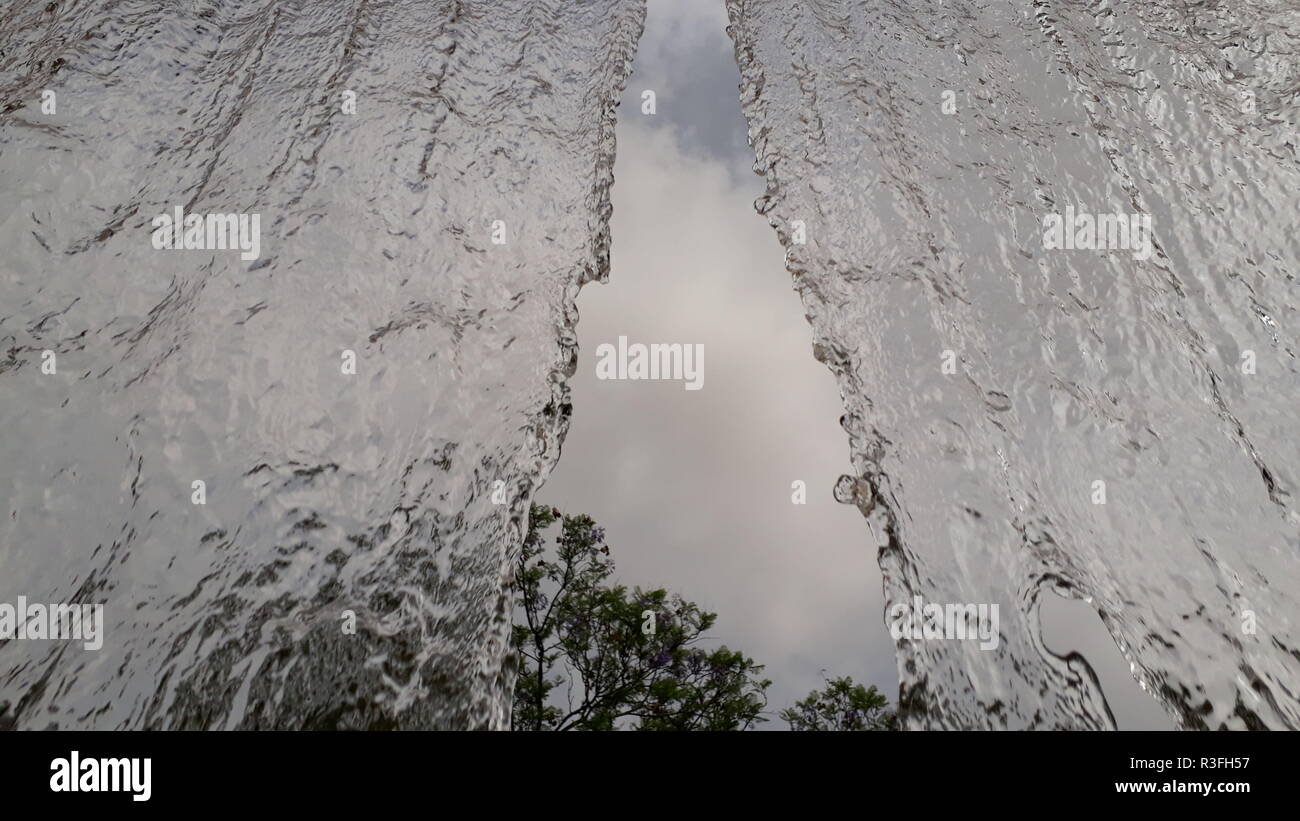 Wide stream of water falling in a semi-translucent park Stock Photo - Alamy