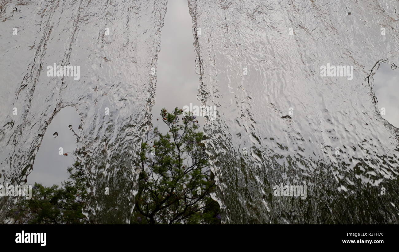 Wide stream of water falling in a semi-translucent park Stock Photo - Alamy