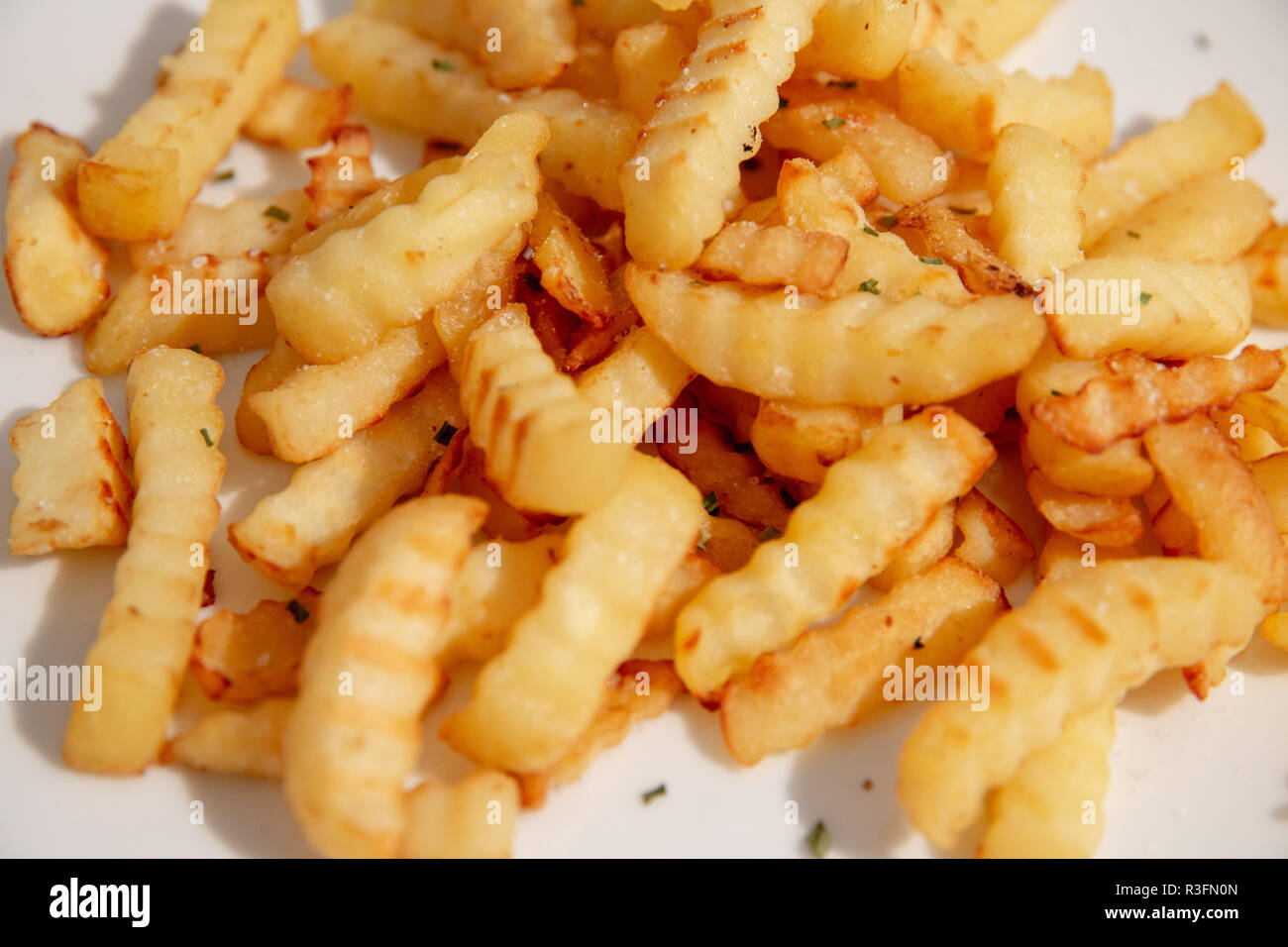 Chips, chrinkle chips cooked, french fries food Stock Photo - Alamy