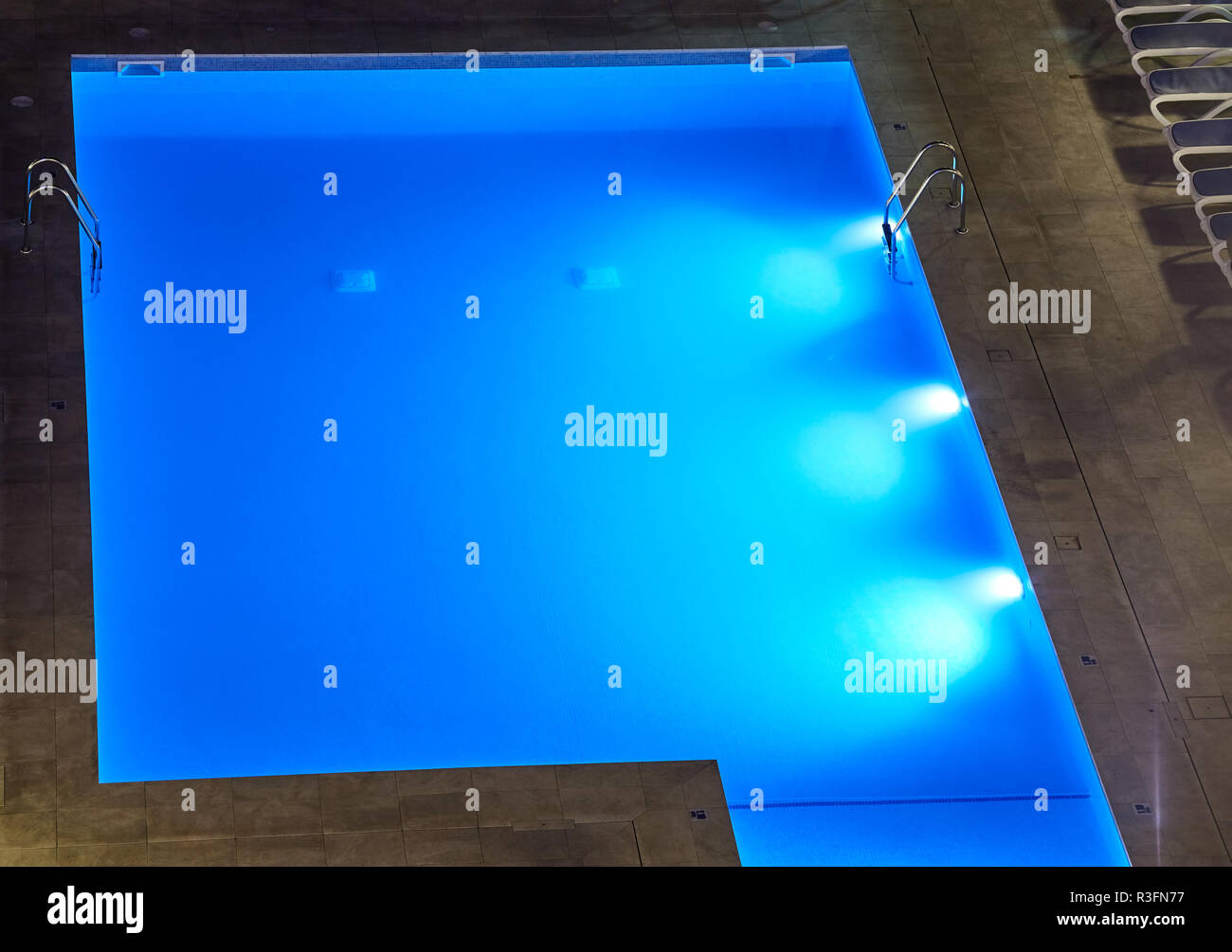 Swimming pool seen from above at night Stock Photo - Alamy