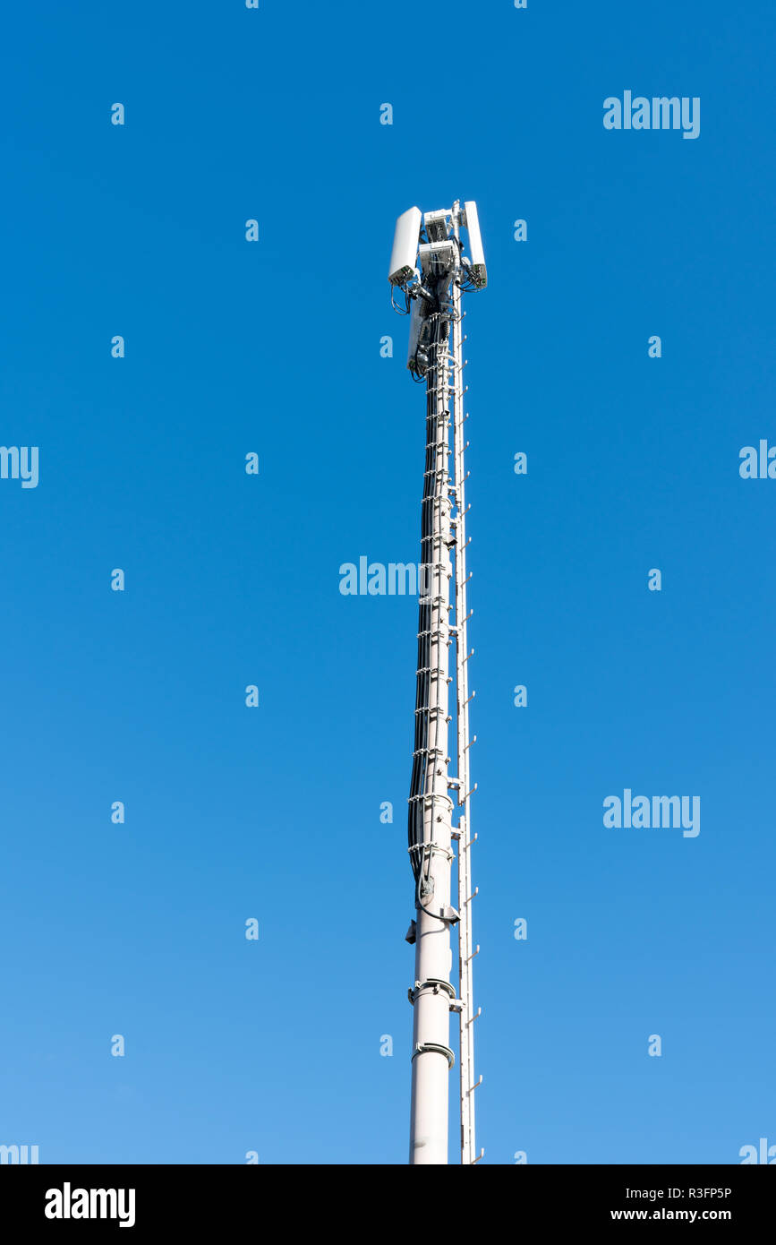 vertical view of a tall antenna tower for mobile and cellular telephone ...