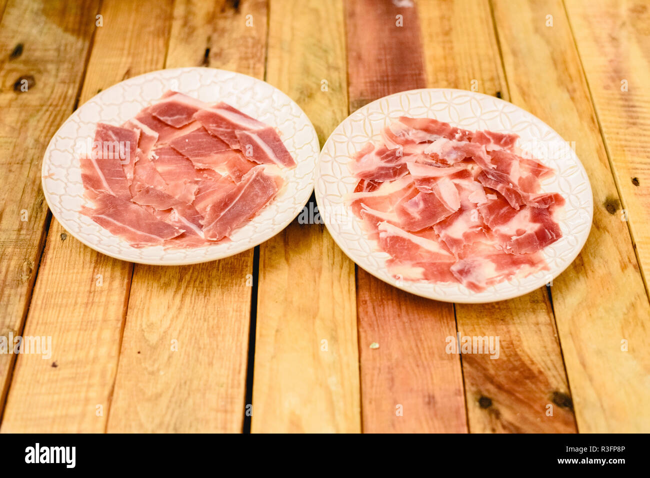 Serrano ham dish just cut to be more tasty and healthy Stock Photo - Alamy