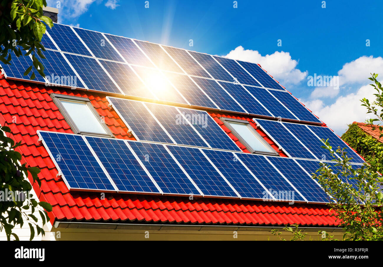 house roof with solar panels and sun Stock Photo - Alamy