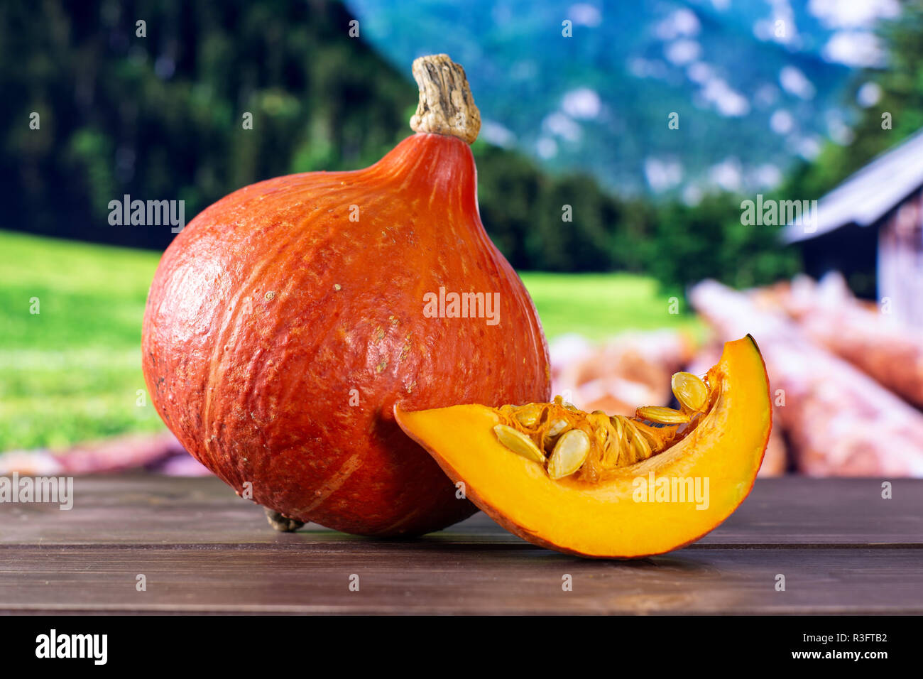 Group of one whole one slice of fresh red kuri pumpkin hokkaido variety ...