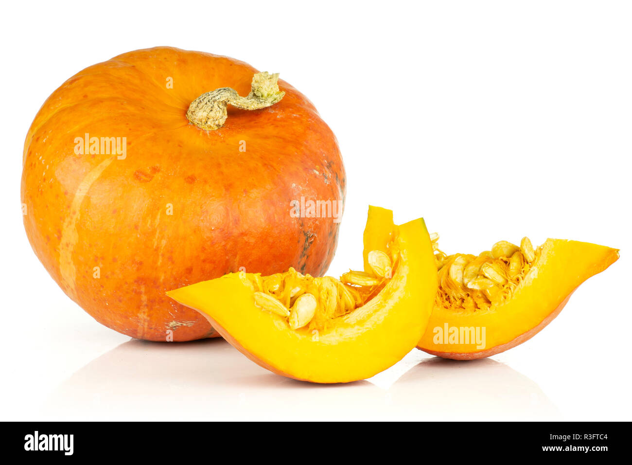 Set of one whole two slices of fresh red kuri pumpkin hokkaido variety ...